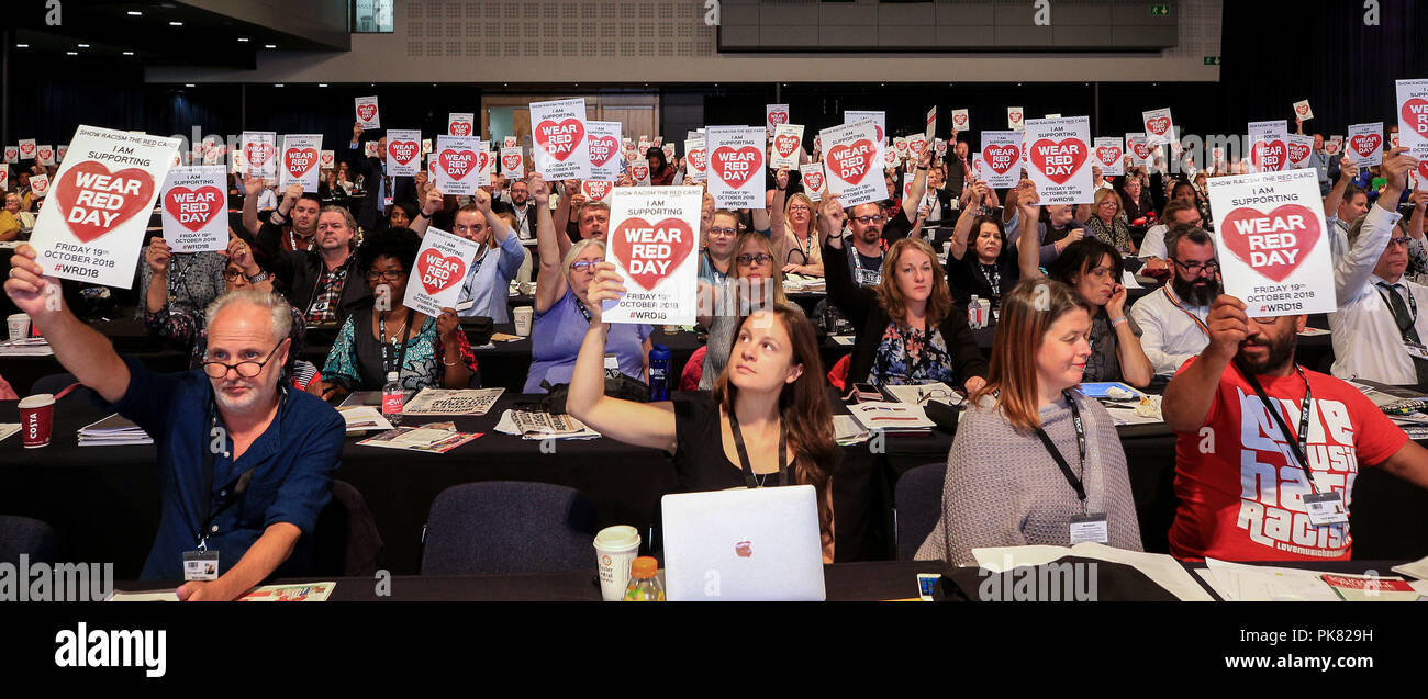 Delegates hold up a red cards to show racism the red card at the TUC ...