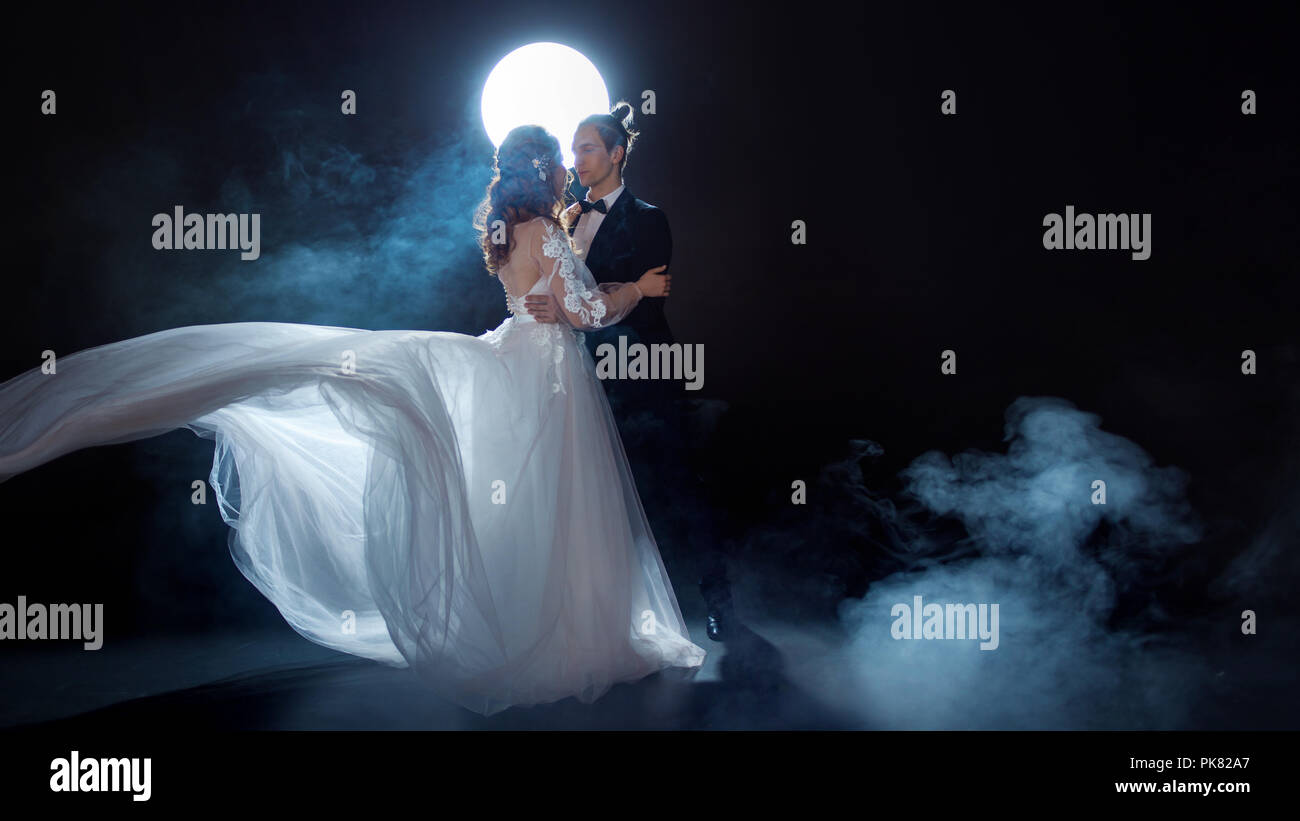 Mysterious and romantic meeting, the bride and groom under the moon ...