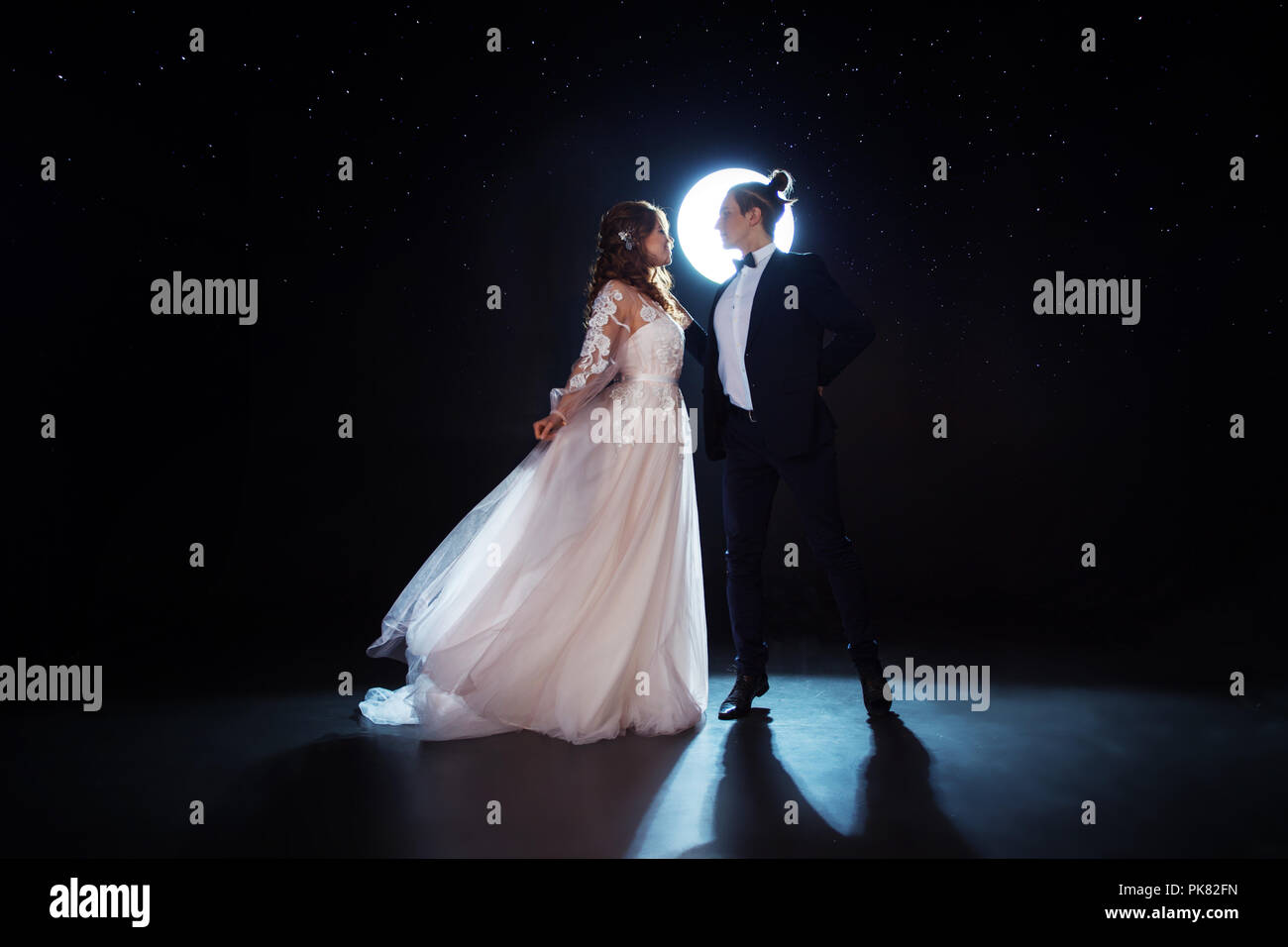 Mysterious and romantic meeting, the bride and groom under the starry ...