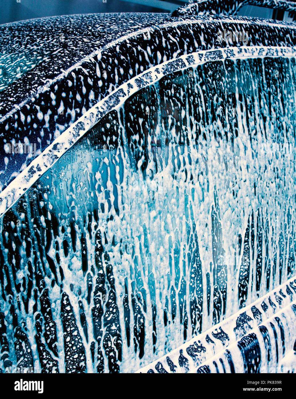 Soap on a car window while washing Stock Photo - Alamy