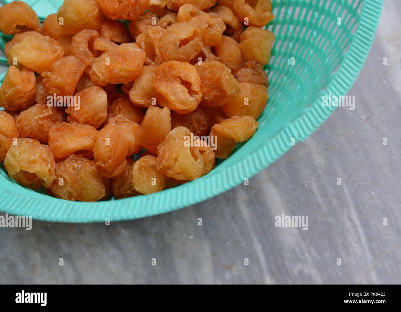 dry longan in plastic basket Stock Photo - Alamy