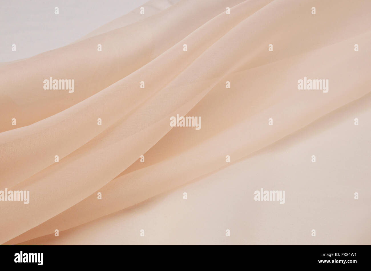 Silk fabric, organza is light beige Stock Photo - Alamy