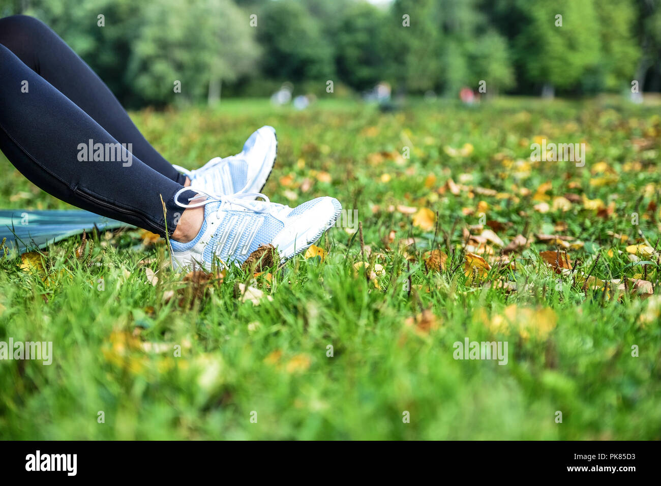 Sports girl resting on the Mat after exercise. Healthy lifestyle Stock ...