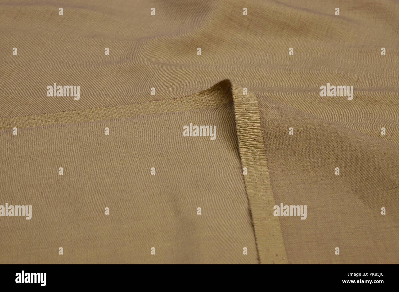 Cotton fabric of light brown color Stock Photo - Alamy