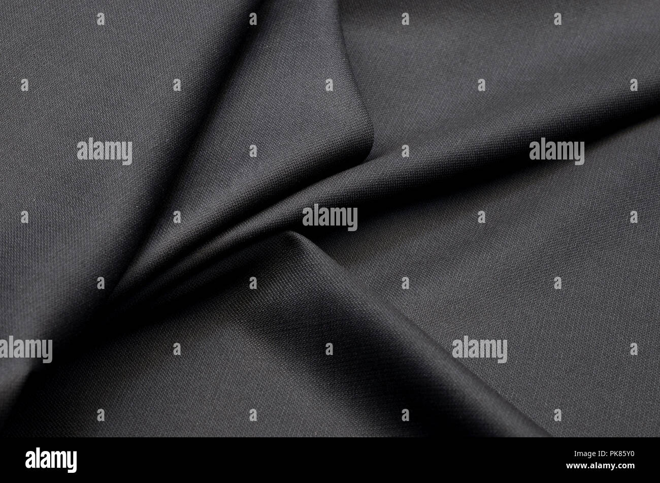 Fabric suit black stretch out of wool Stock Photo - Alamy