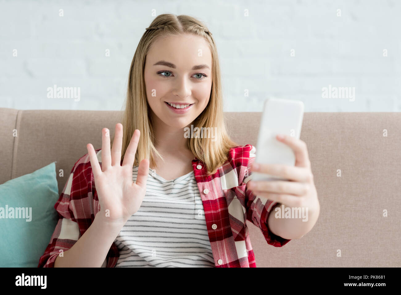close-up portrait of teen student girl making video call with ...
