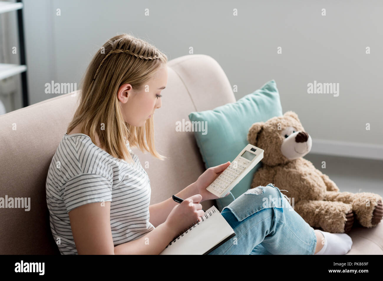 Beautiful teen girl writing in notebook hi-res stock photography and ...