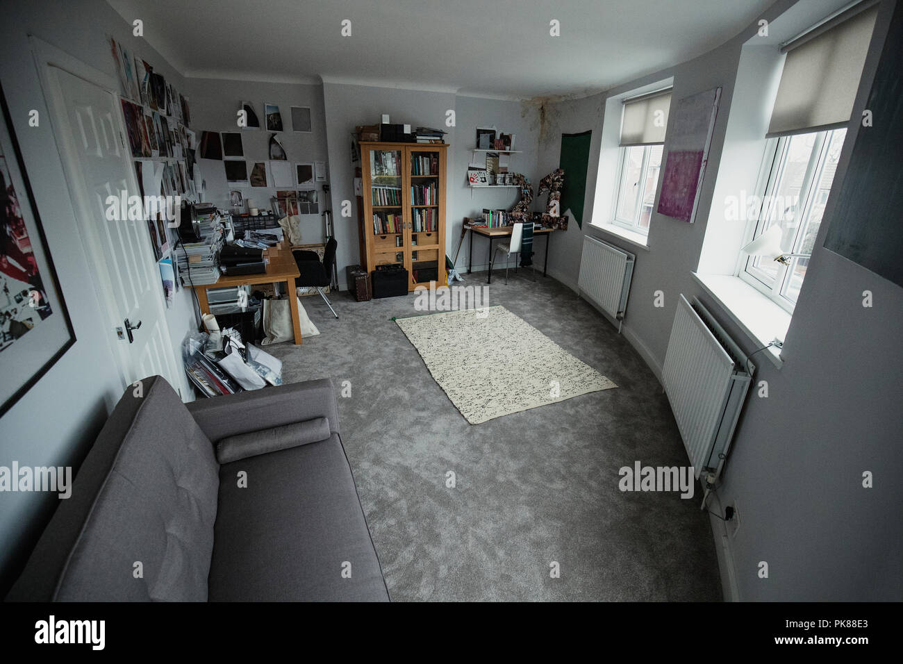 Empty study room decorated with art and personal items Stock Photo - Alamy
