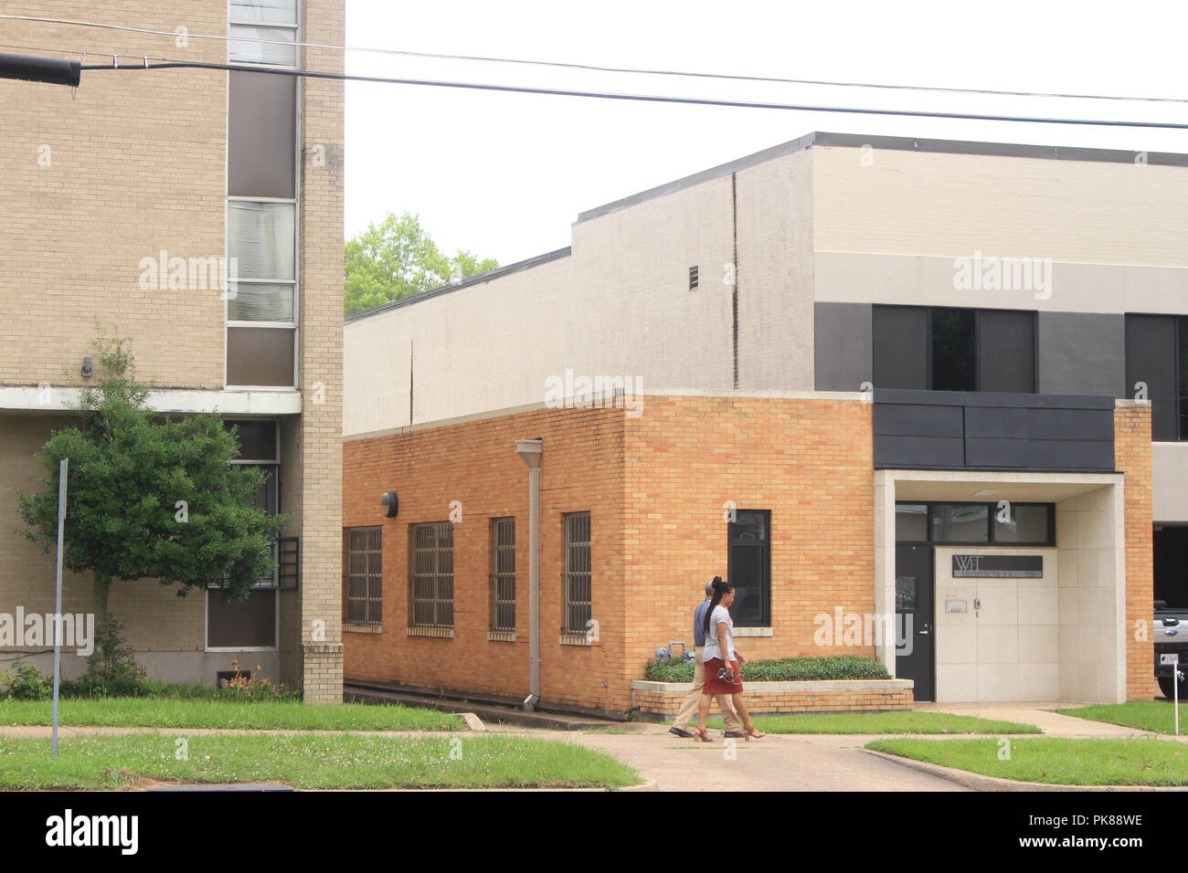 People walking passed office buildings Stock Photo - Alamy