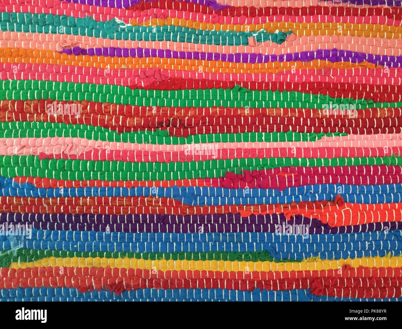 Rows of colorful fabric from background with textures. Colorful rug ...