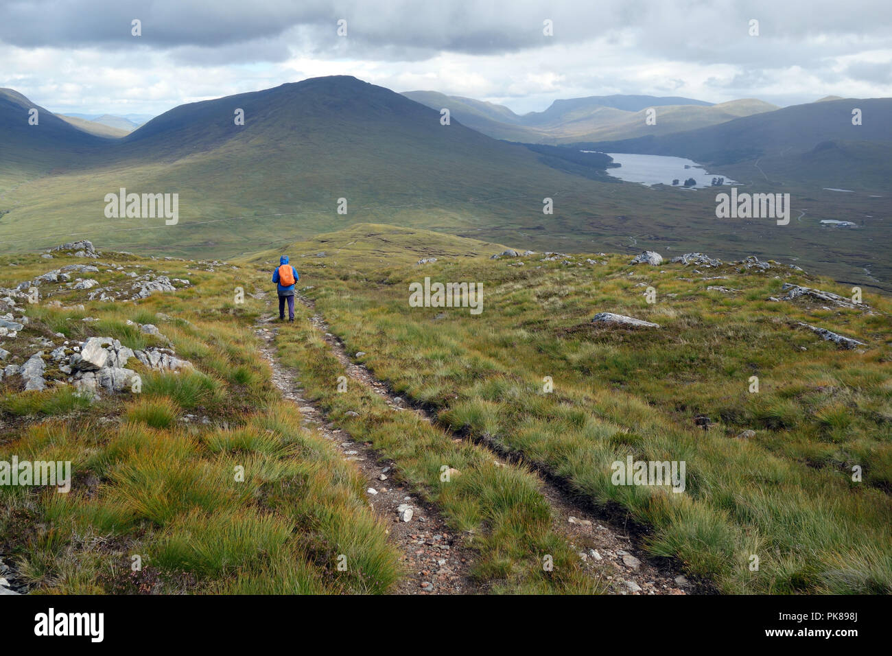 Man Walking down the Scottish Mountain Corbett Leum Uilleim with Loch ...