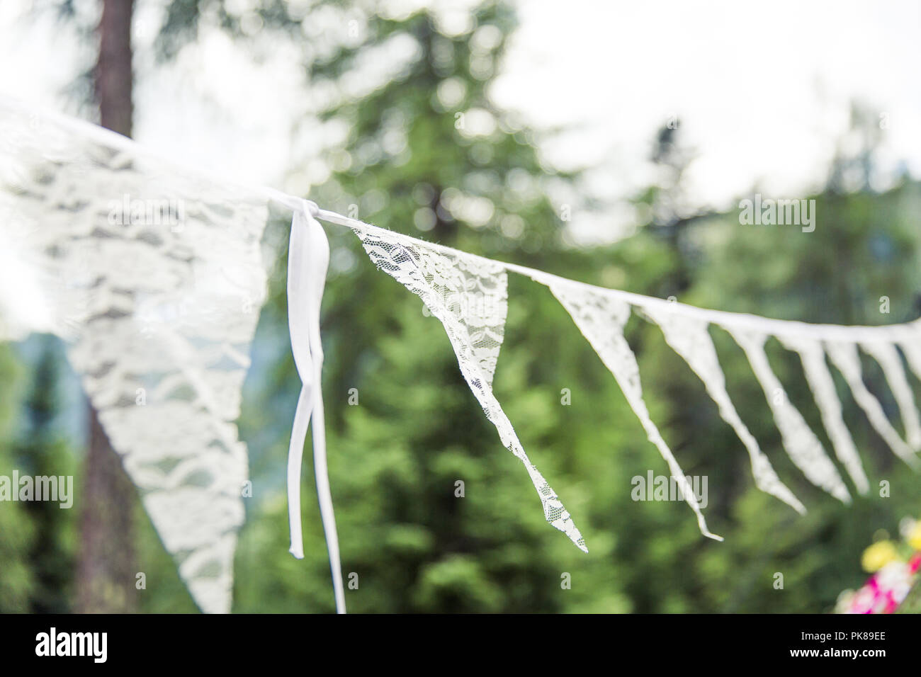 White Lace Wedding Banner Floating in the Wind Outside Stock Photo - Alamy