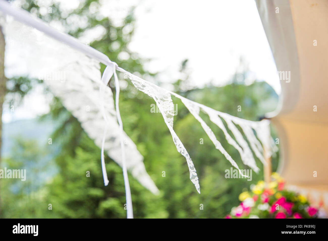 White Lace Wedding Banner Floating in the Wind Outside Stock Photo - Alamy