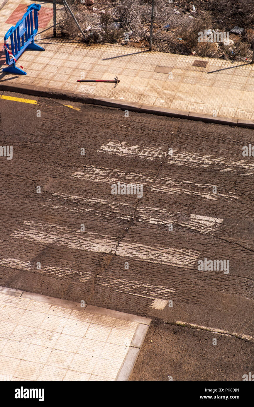 Road surface scrapped away in preperation for new layer of asphalt to ...