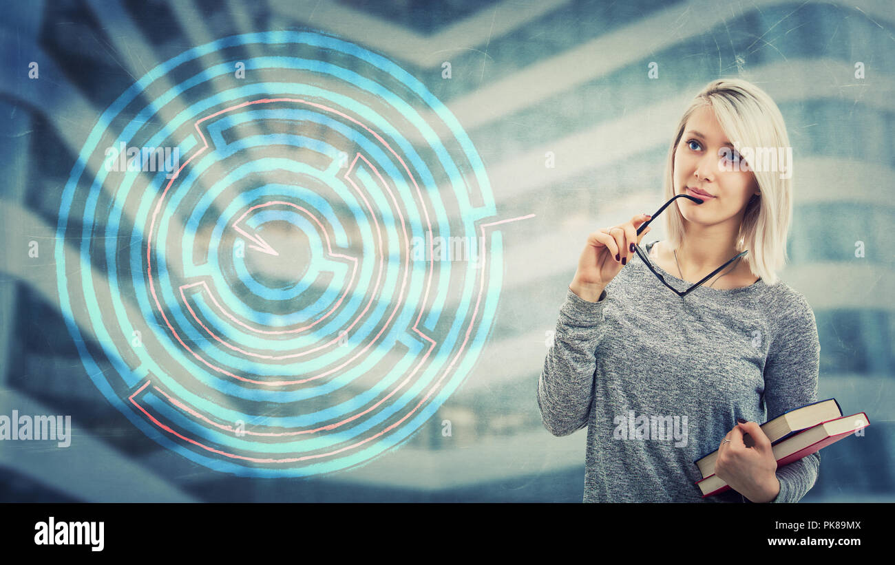 Smart girl holding books thinking on solving the maze. Student find ...