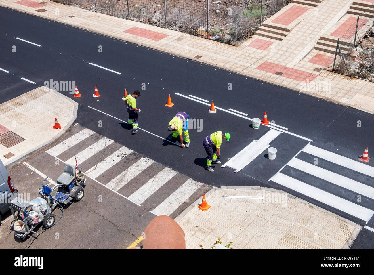 Painting new road markings on a newly resurfaced road Stock Photo - Alamy