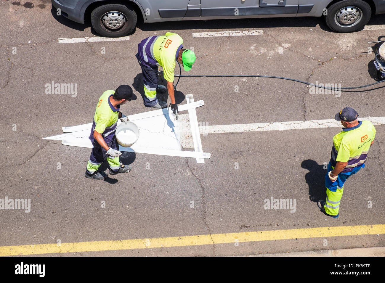 Painting new road markings on a newly resurfaced road Stock Photo - Alamy