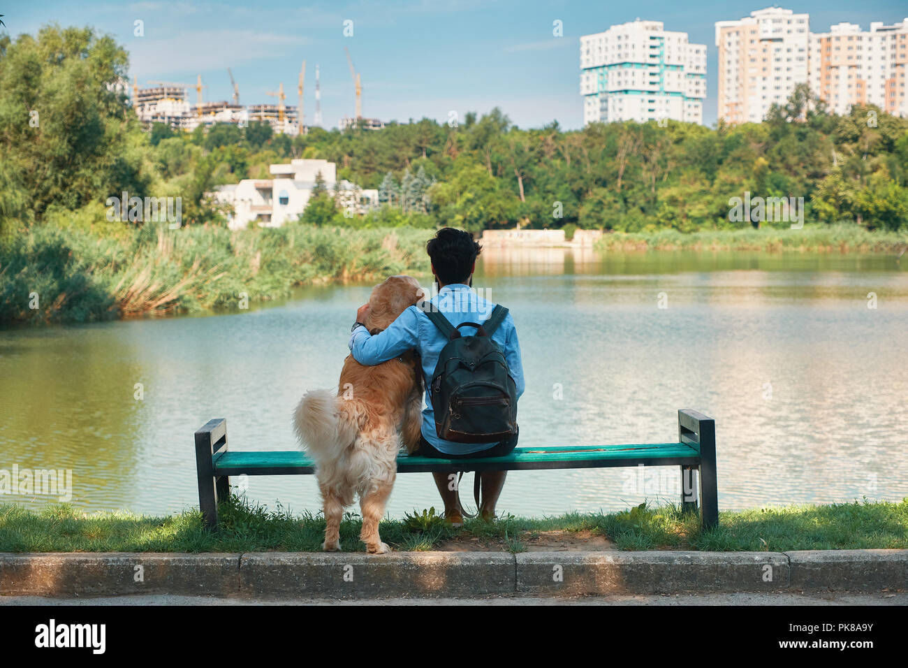 Back view man his dog sitting on hi-res stock photography and images ...