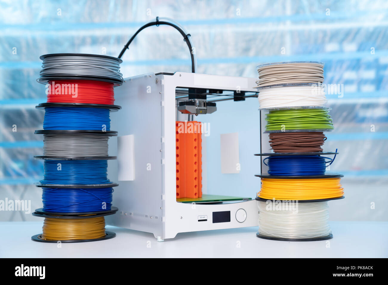 ABS and PLA filament next to 3D Printer. Plastic coils Stock Photo - Alamy