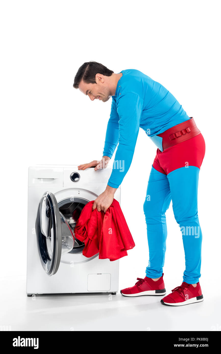 smiling washing clothes in washing machine on white Stock Photo - Alamy