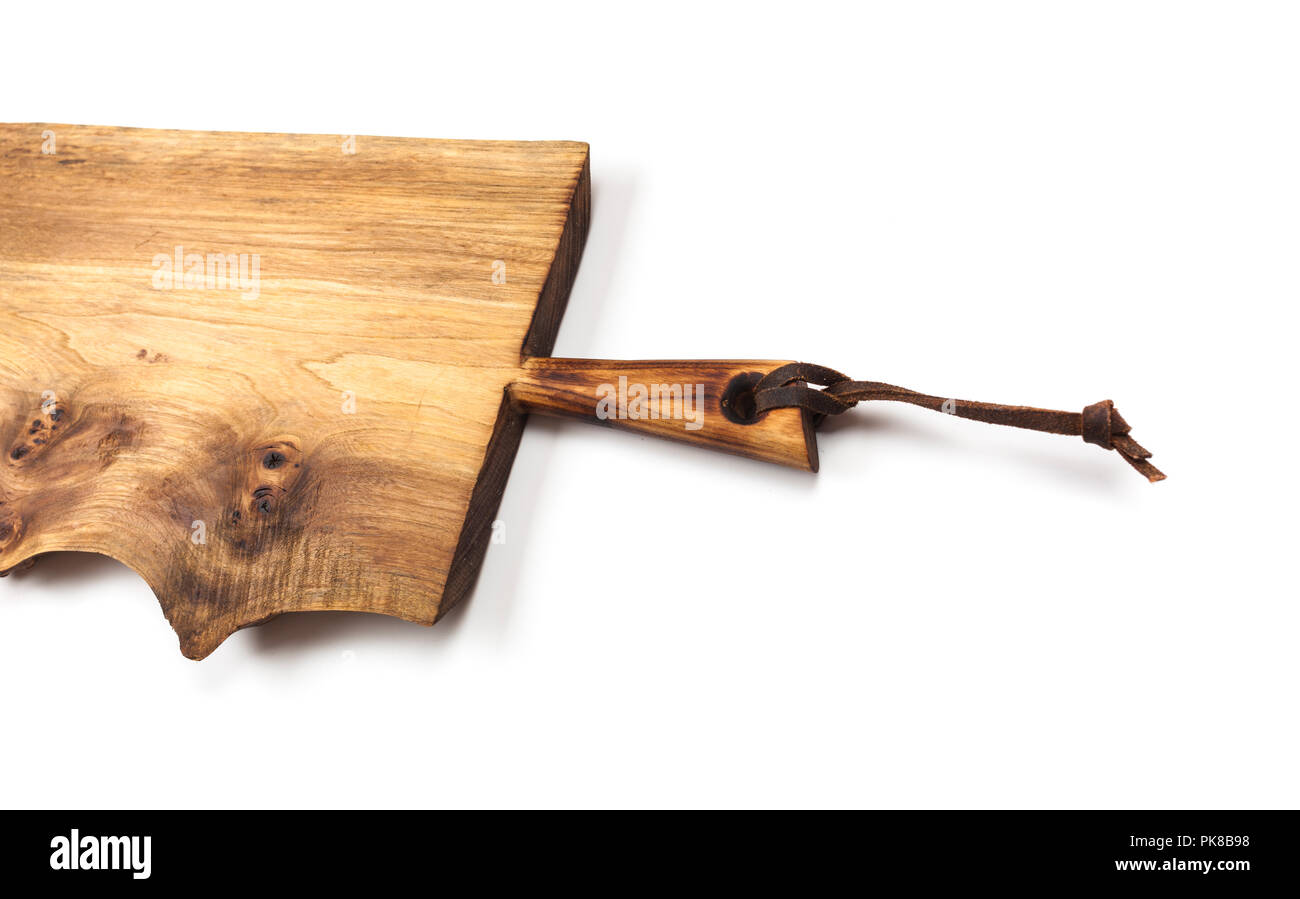 Surface of the old wooden planks kitchen board with leather strap ...