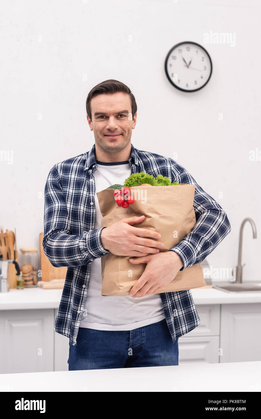 Man carrying grocery hi-res stock photography and images - Alamy