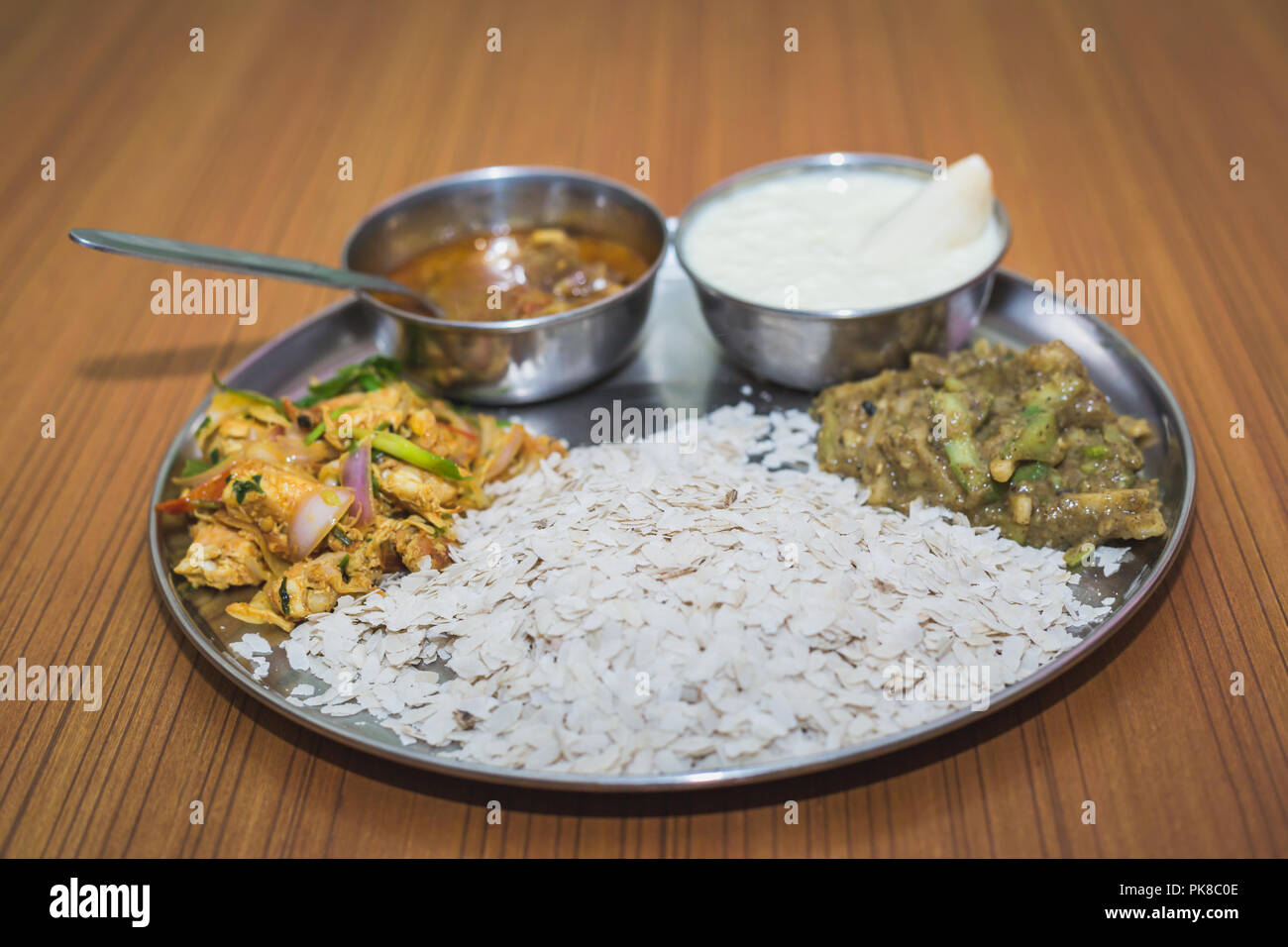 Nepali Style snacks or Khaja Set on the plate with meat,curd,pickle ...