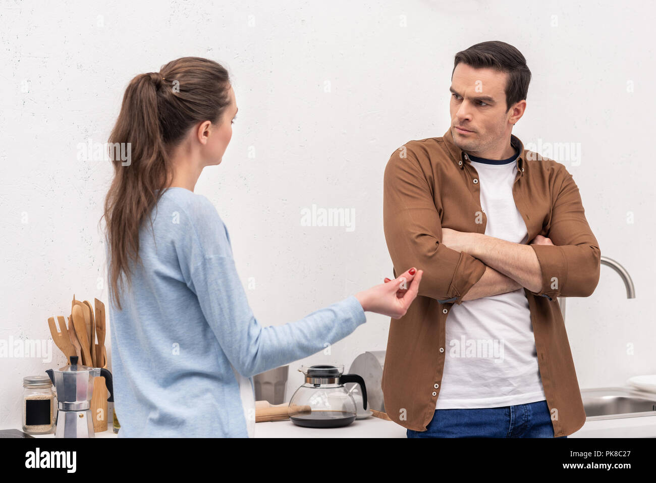 mad adult couple having argument at kitchen Stock Photo - Alamy