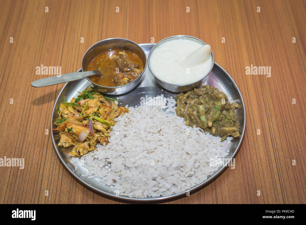 Nepali Style snacks or Khaja Set on the plate with meat,curd,pickle ...