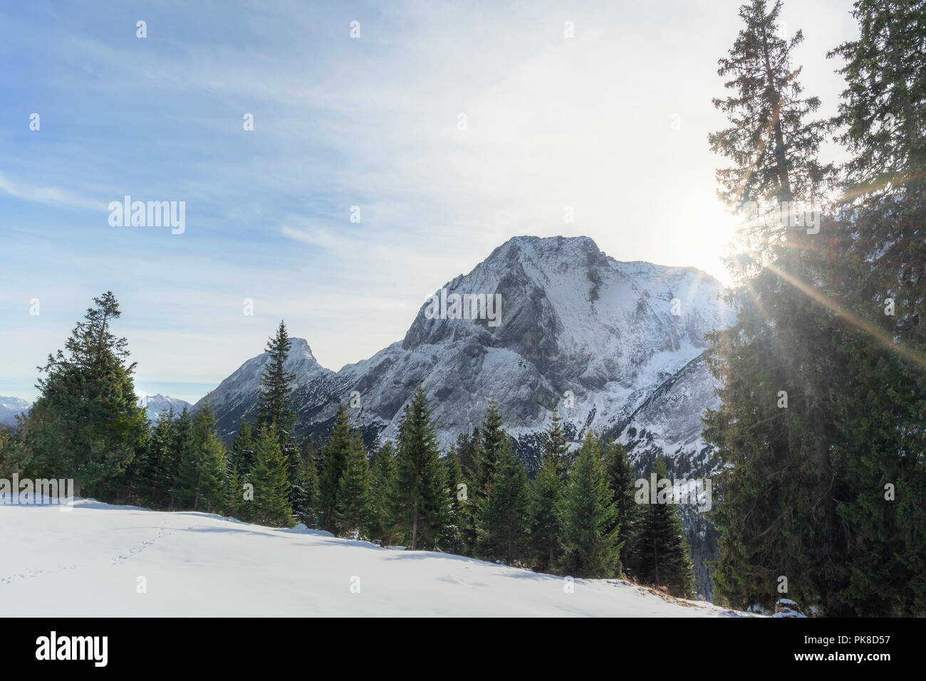 Winter scenery with the sun shining over the snowy Austrian Alps, the ...