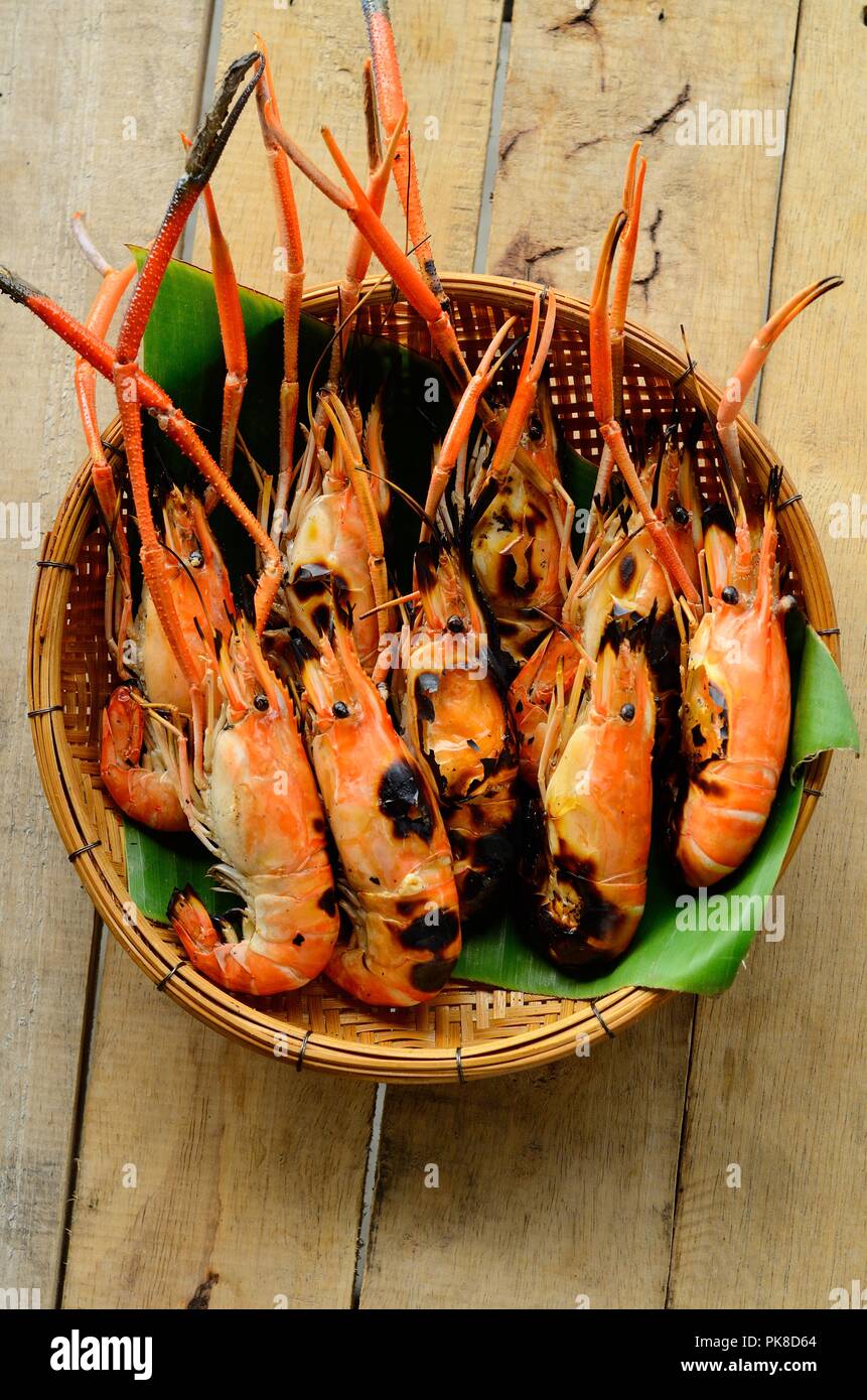 Grilled giant freshwater prawn on the wooden table Stock Photo - Alamy