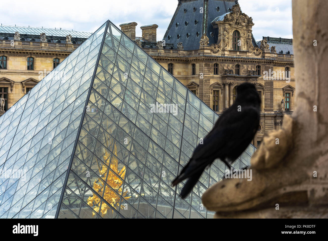 Louvre museaum during cloudy day and black crow,Paris,France Stock ...
