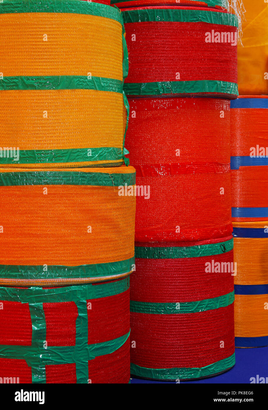 Packaging knitted net rolls for fruits and vegetables Stock Photo - Alamy