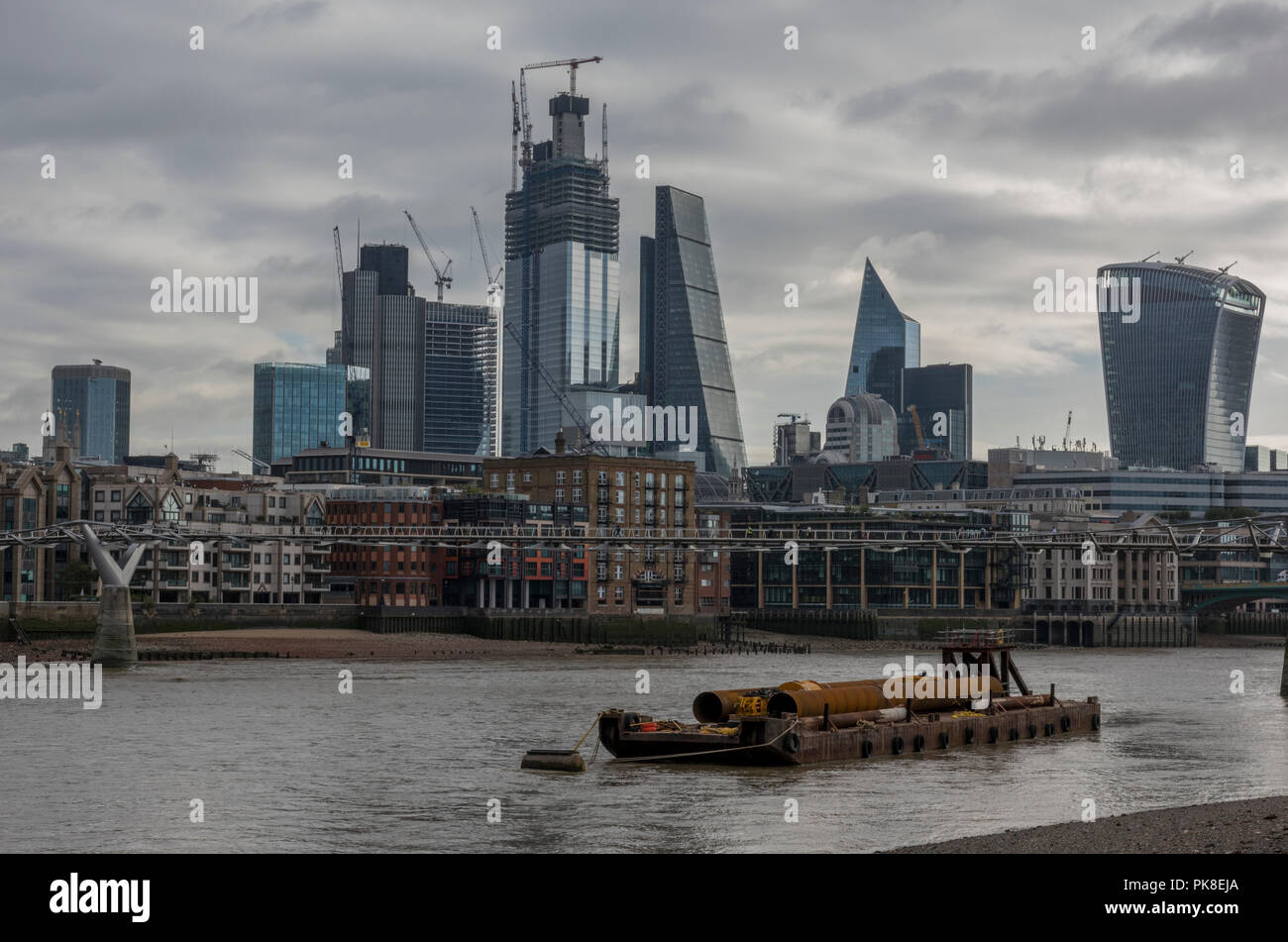 the city of London skyline on a grey and overcast day with a ...