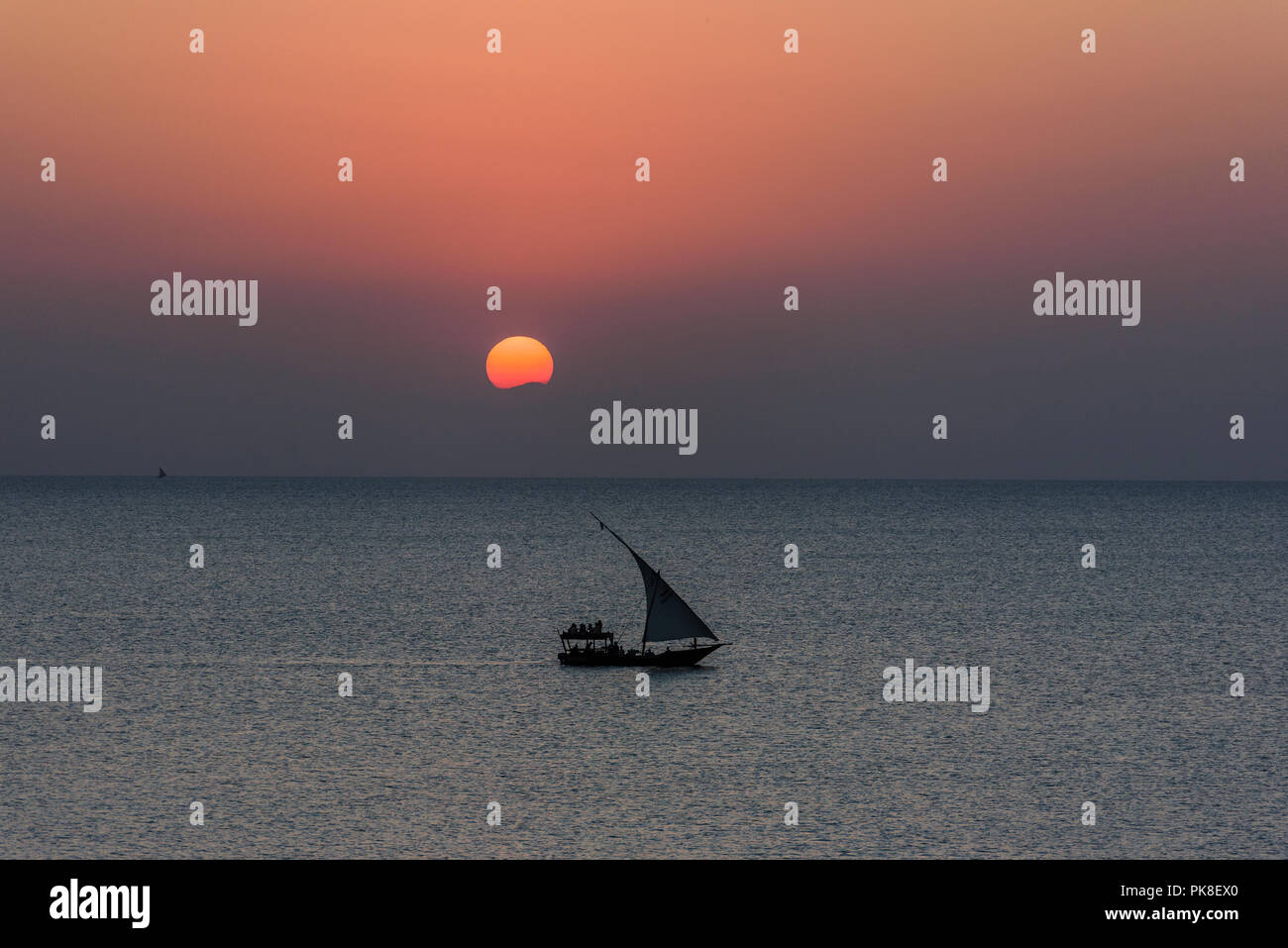 Sunset in Zanzibar with dhow Stock Photo - Alamy