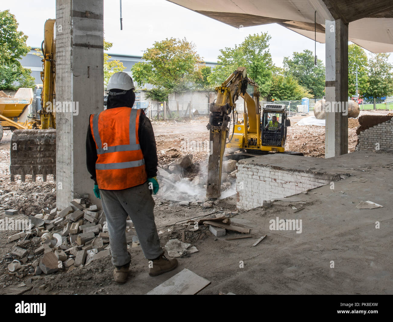 Impactor breaking concrete during demolition Stock Photo - Alamy