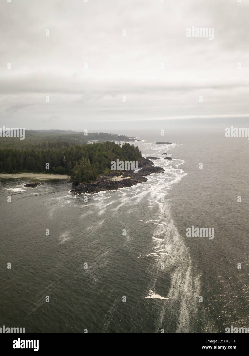 Aerial seascape view of the Pacific Ocean Coast during a cloudy summer ...