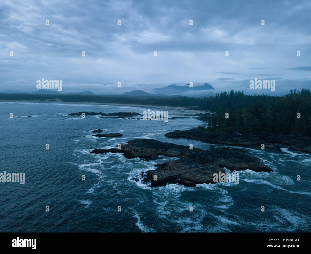 Aerial seascape view of the Pacific Ocean Coast during a cloudy summer ...