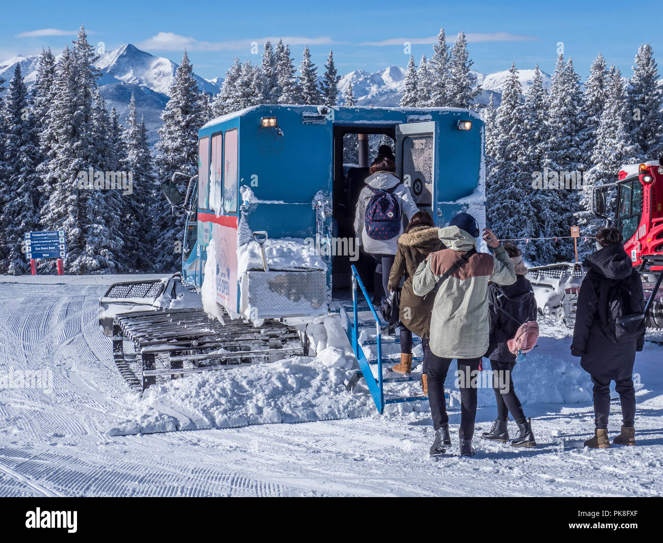 Women board snowcat near Henry's Hut, winter, Vail Ski Resort, Vail ...
