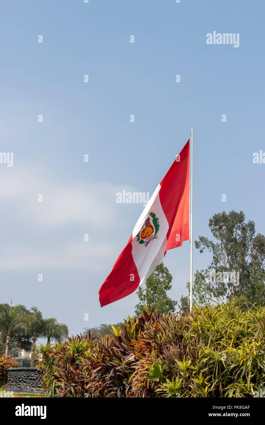 Flag of Peru next to blue sky Stock Photo - Alamy