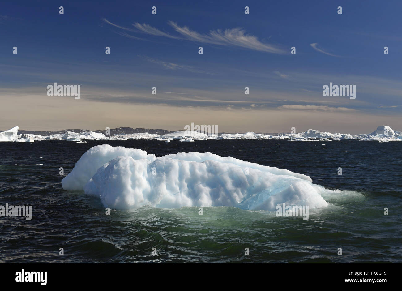 Iceberg floating in the water off the coast of Greenland. Nature and ...
