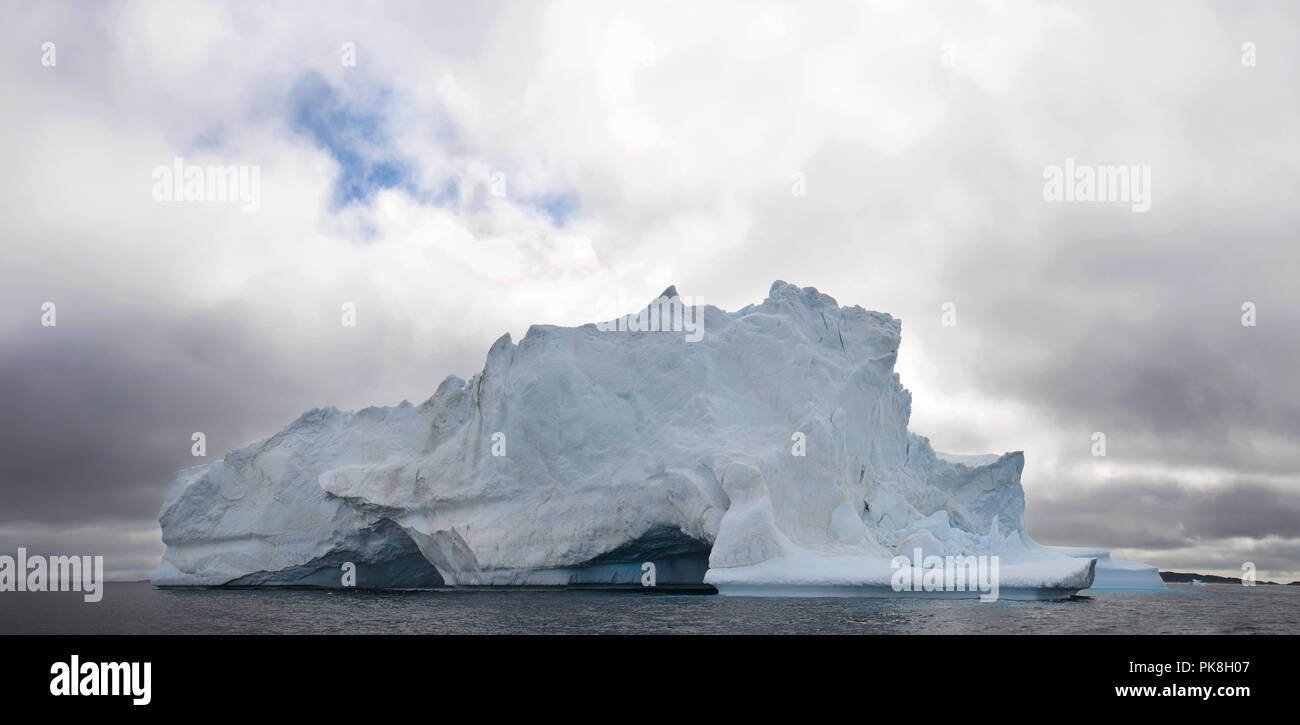 Iceberg floating in the water off the coast of Greenland. Nature and ...