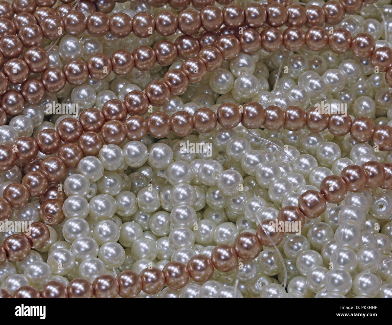 shiny pearl necklaces on display in a jewelry store Stock Photo - Alamy