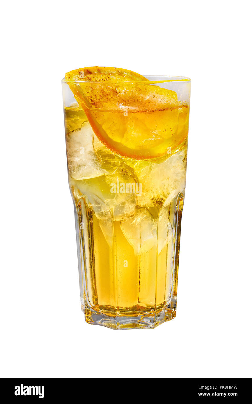 A yellow transparent cocktail, refreshing in a tall glass with ice ...