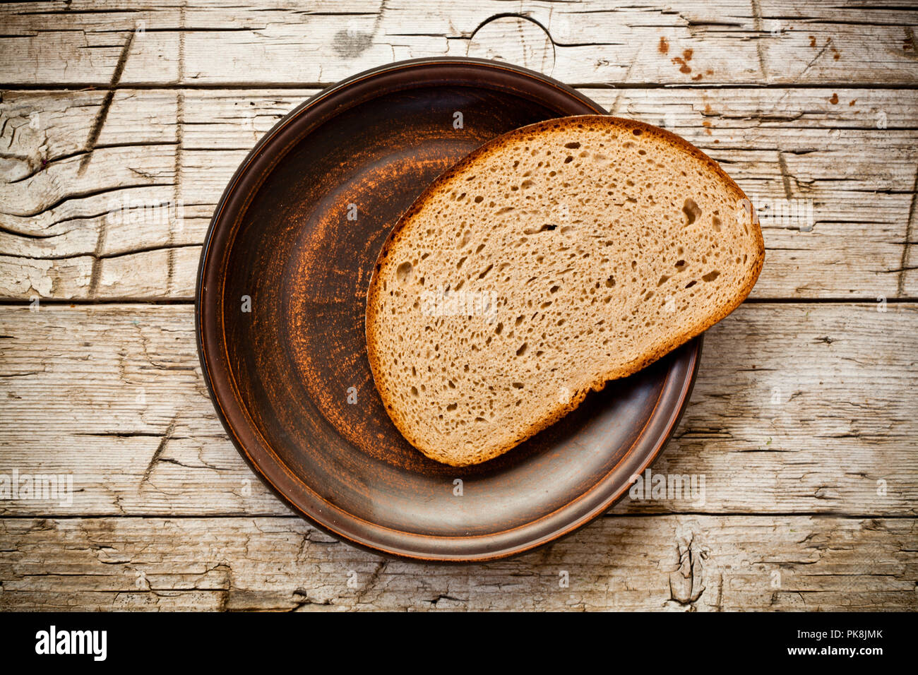 rye bread in a plate on rustic wooden background Stock Photo - Alamy