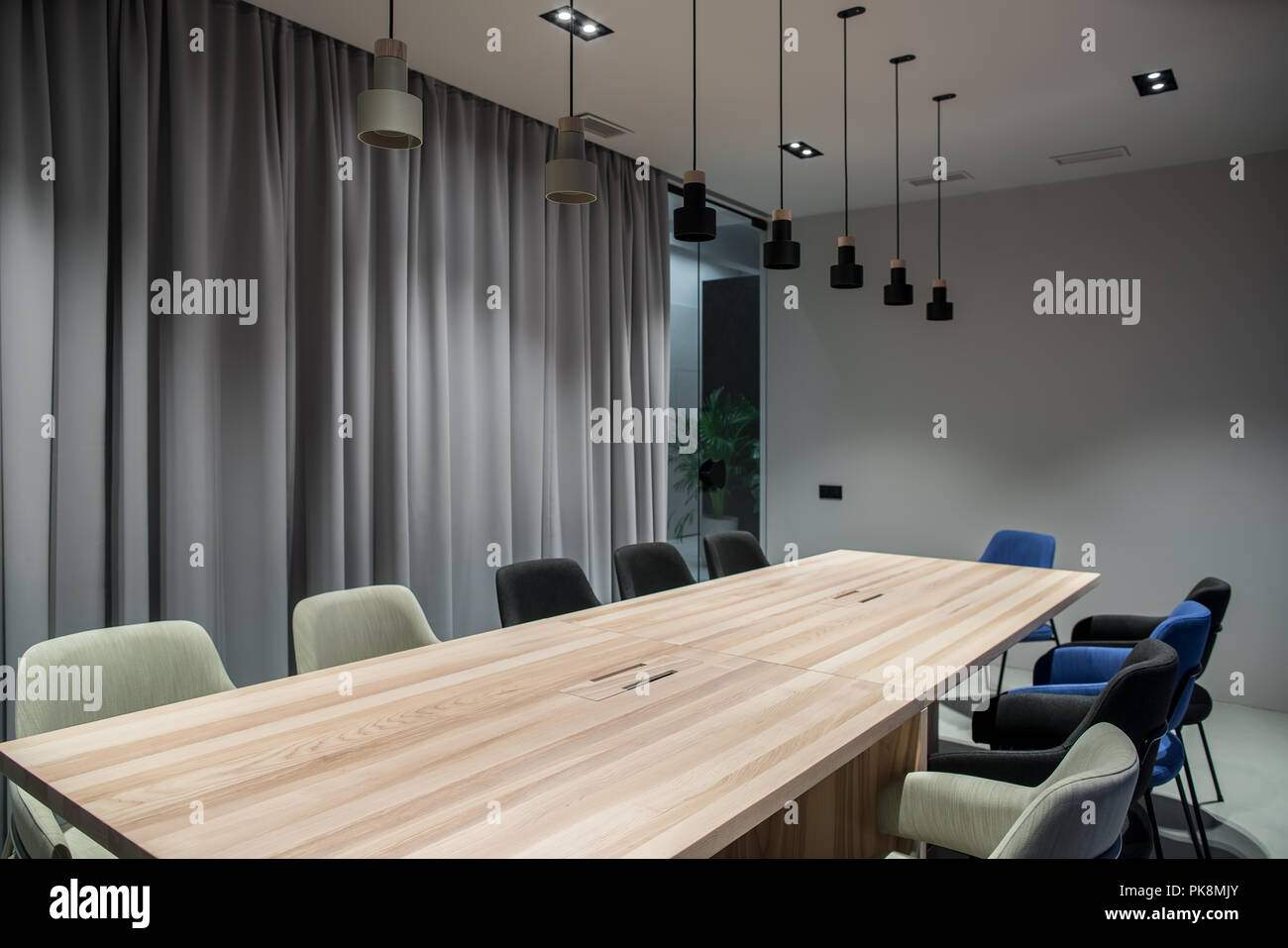 Stylish conference room with gray and blue walls Stock Photo - Alamy