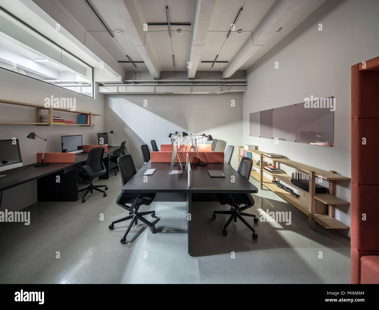 Stylish office in loft style with light walls Stock Photo - Alamy