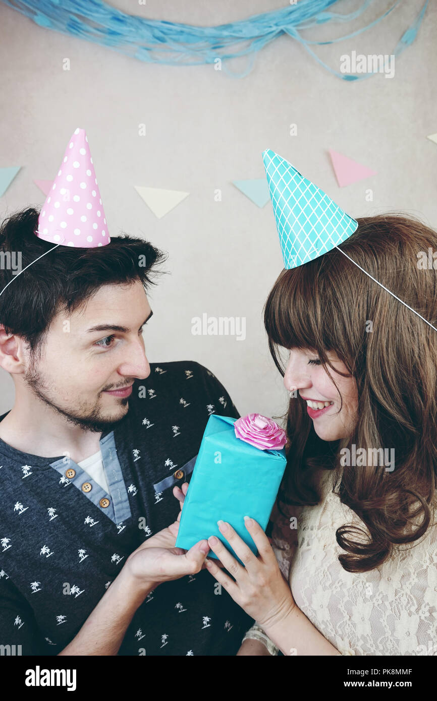 Young couple celebrating a birthday Stock Photo - Alamy