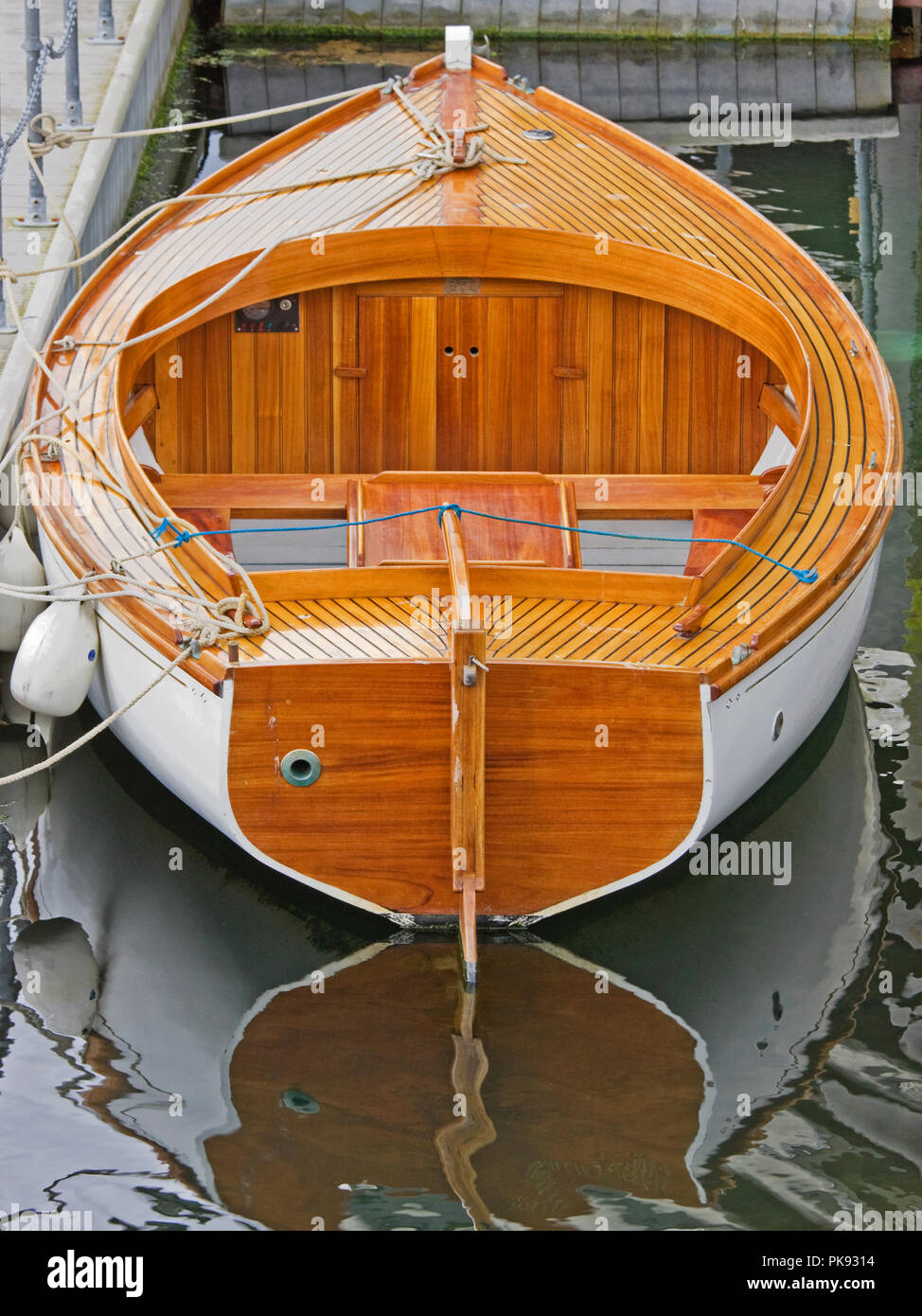 Small sailing boat moored in a UK harbour Stock Photo - Alamy