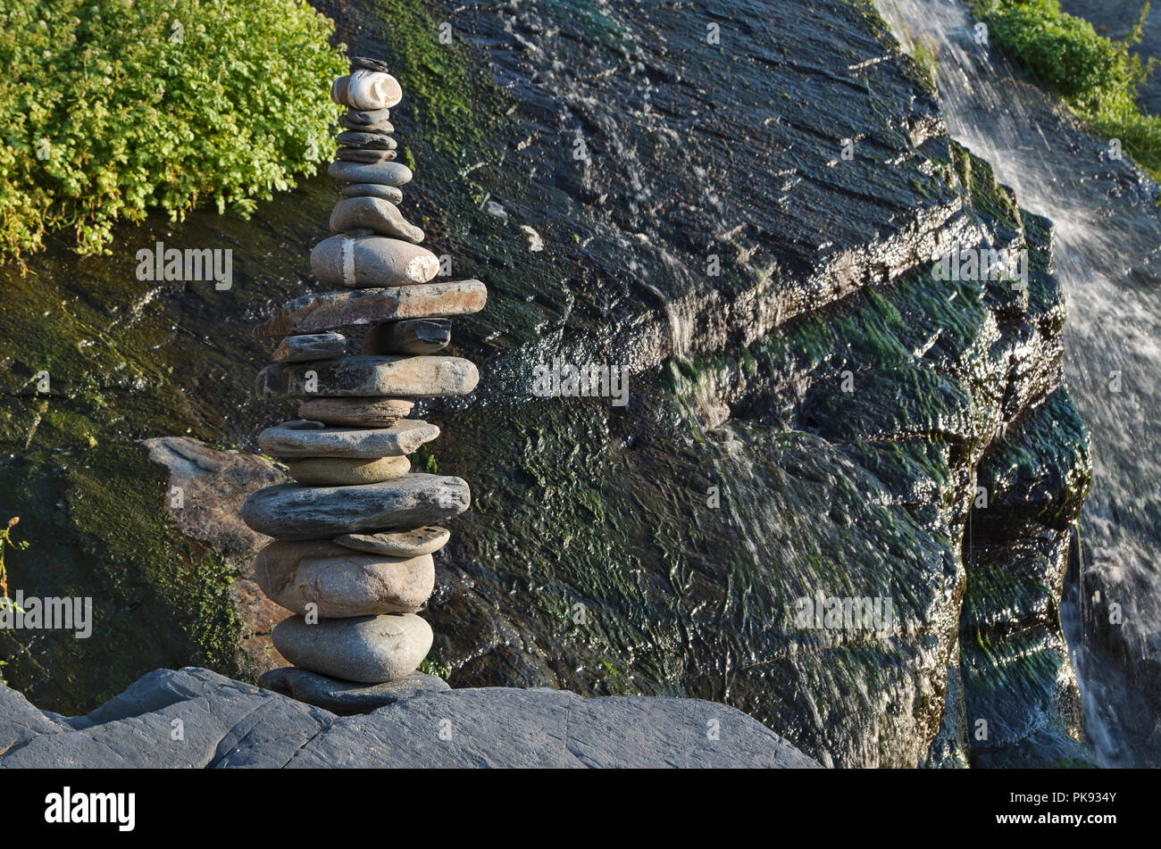 Pile of pebble stones and waterfall. Zen and Harmony themes Stock Photo ...